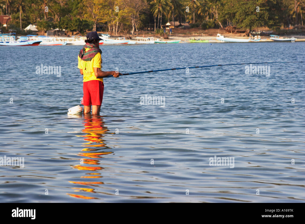 Reflection Of Man Fishing Stock Photo - Alamy