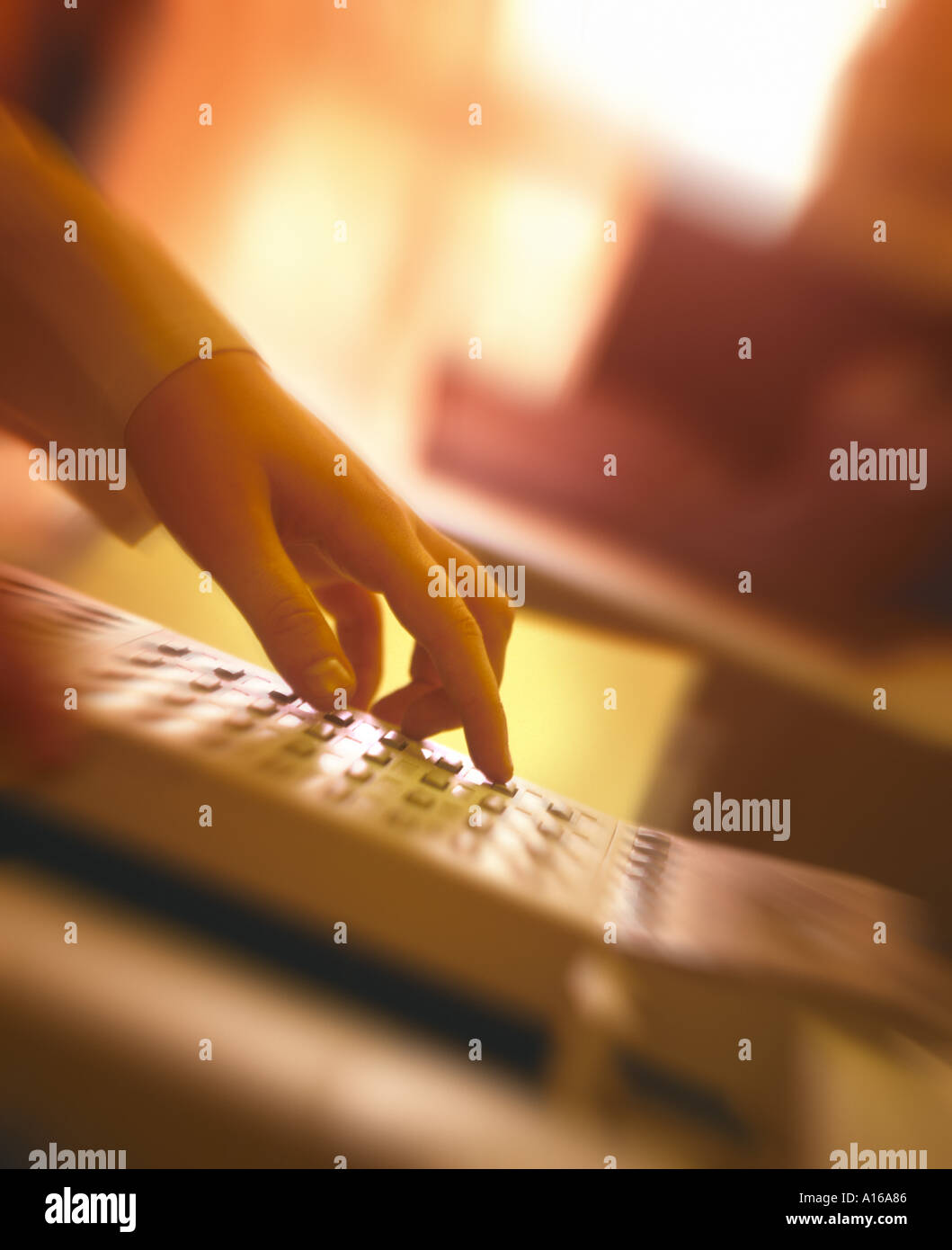 Hand on fax machine keyboard Stock Photo - Alamy