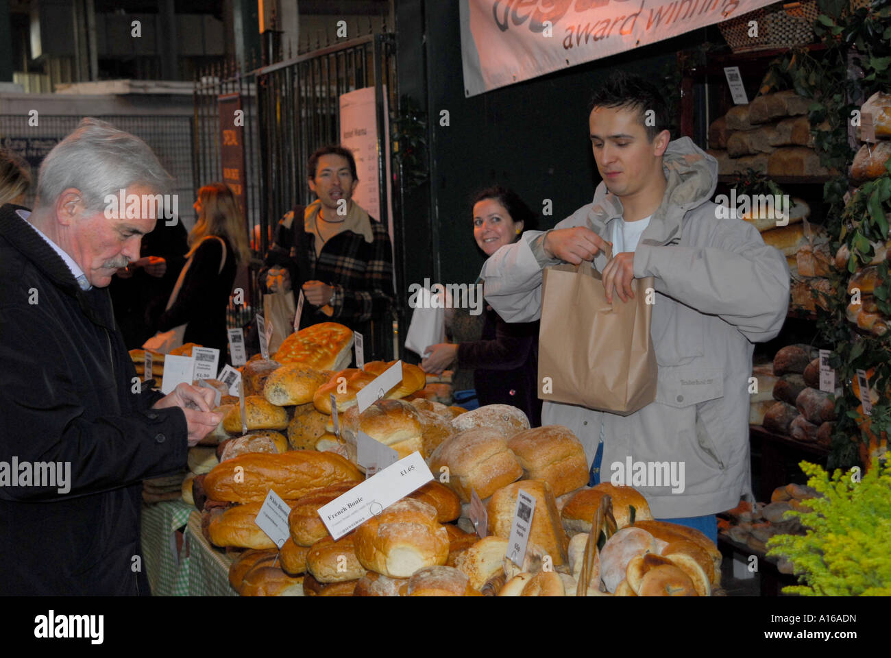 Old man buying bread in hi-res stock photography and images - Alamy