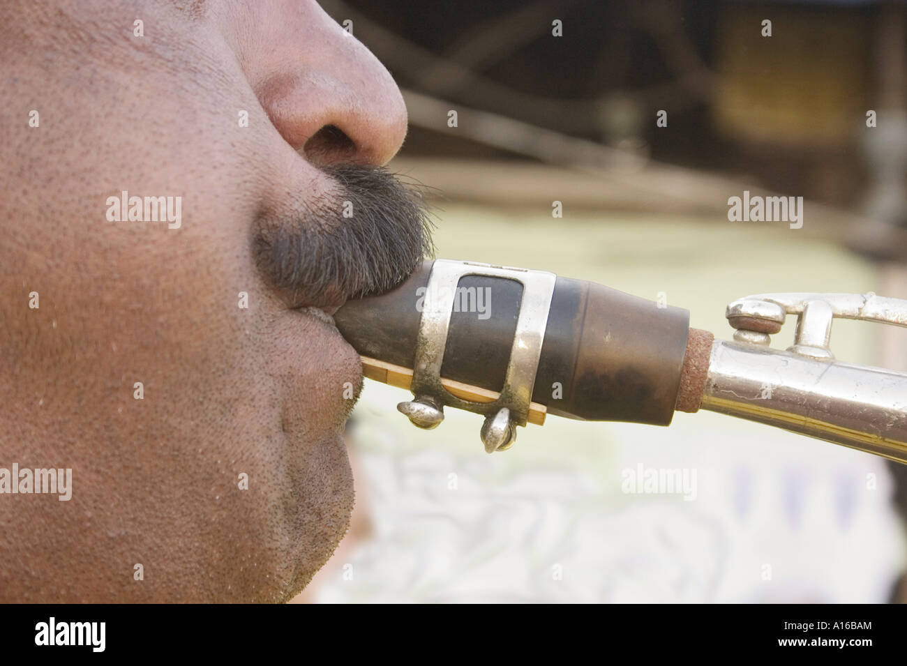 Indian man playing trumpet hi-res stock photography and images - Alamy