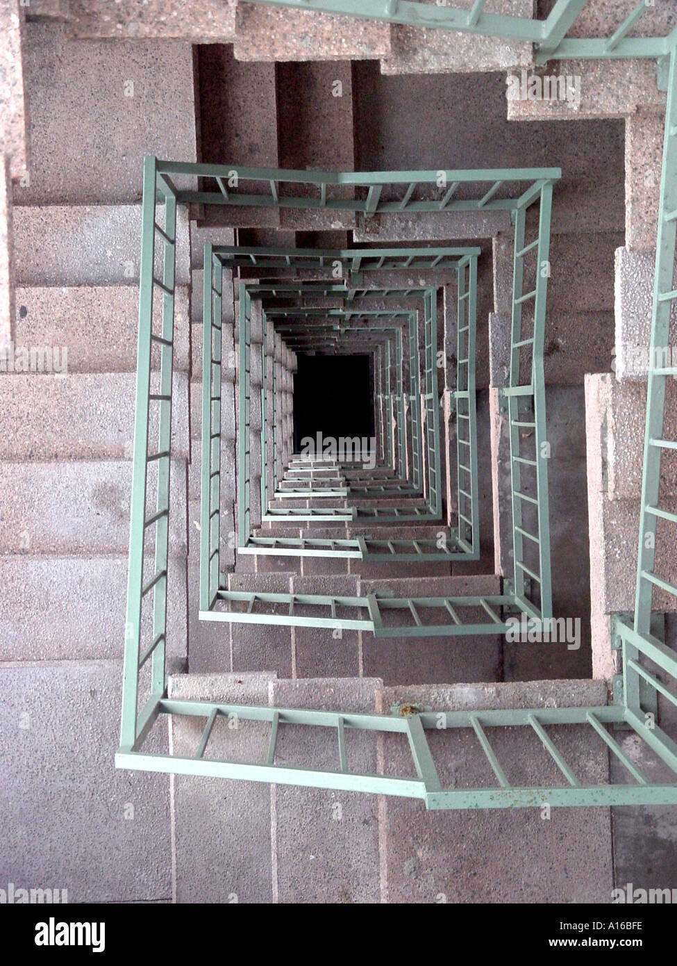 Looking down a square stairwell Stock Photo - Alamy