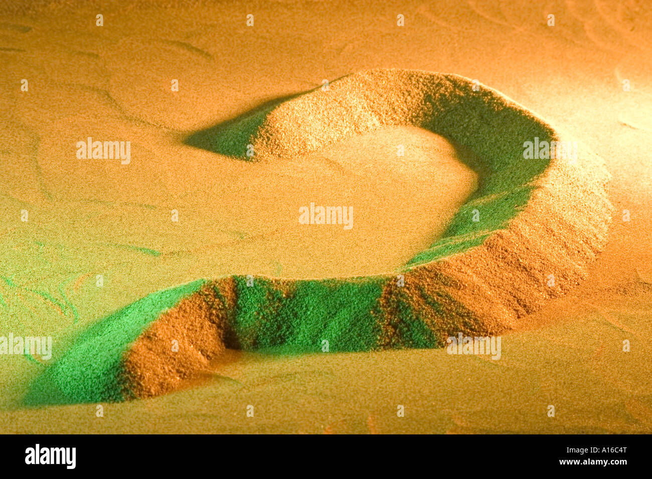 Question mark made sand background hi-res stock photography and images ...