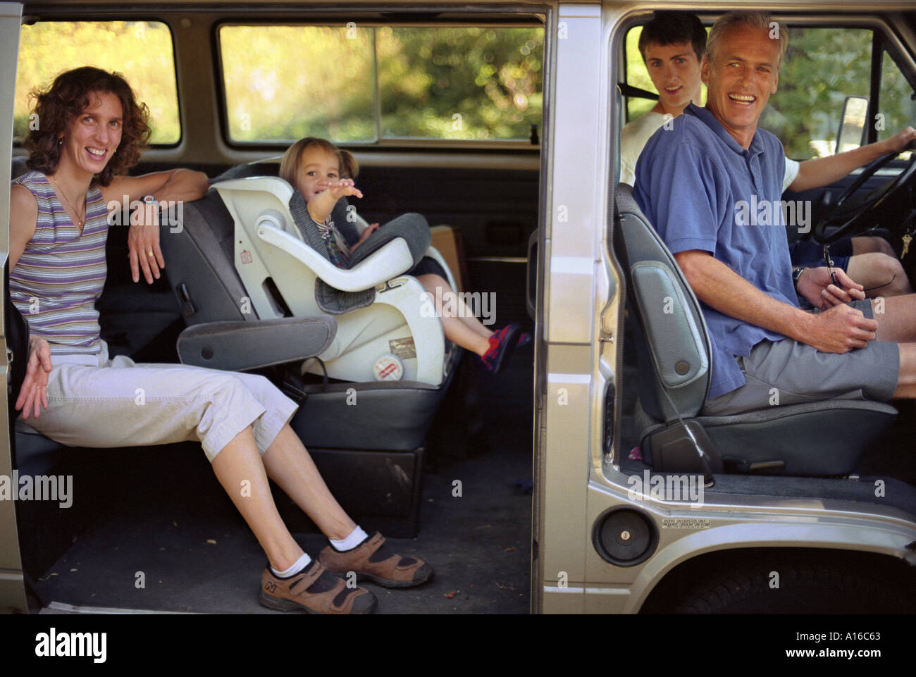 A family going for a drive A teenage son is driving his father mother ...