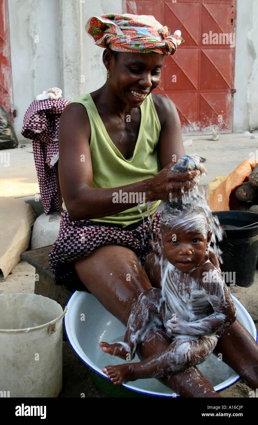 Mother Bathing Baby In Africa