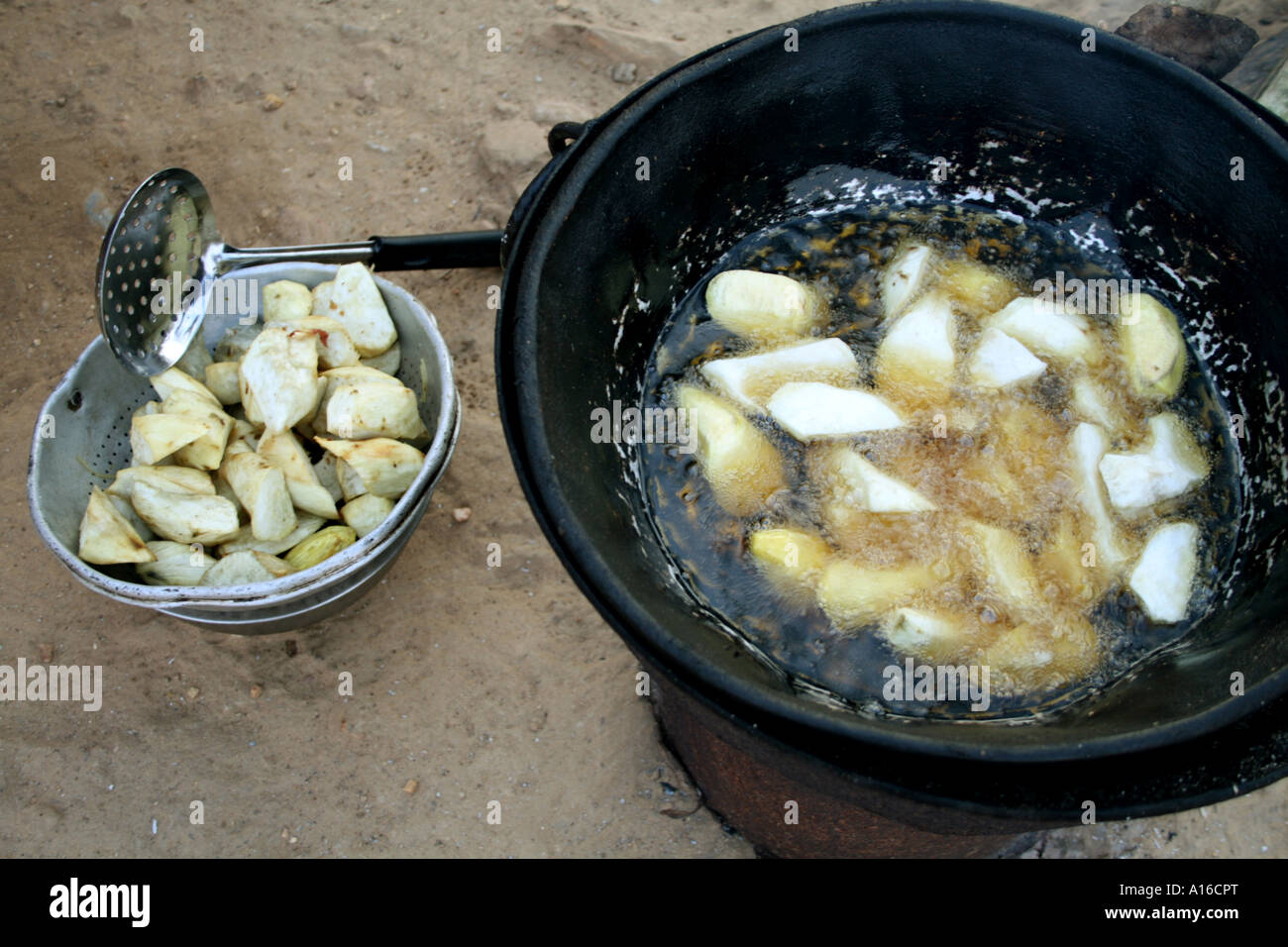Yams frying on a street stall , Kpalime Stock Photo - Alamy