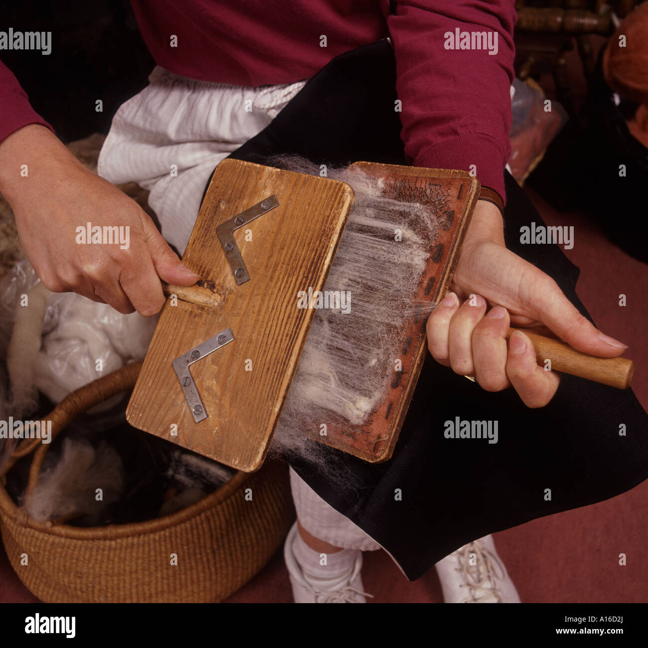 Spinning on a traditional wheel, before spinning the wool is prepared ...