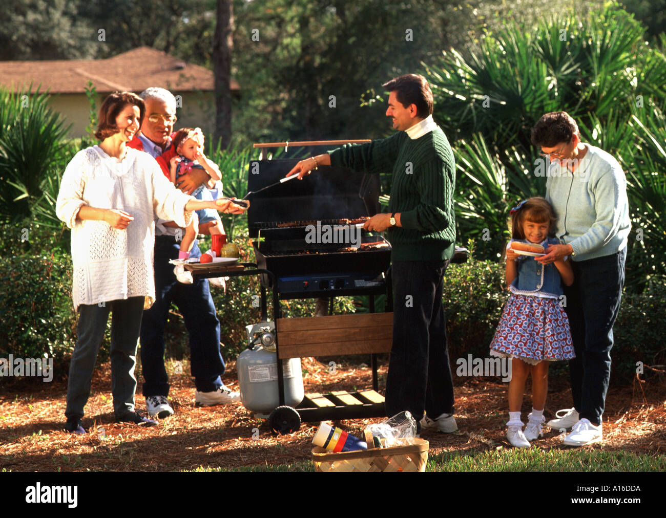3 generation Hispanic family having a barbecue Stock Photo - Alamy