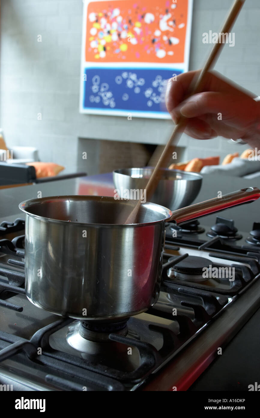 Cooking on the gas fired hob at home Stock Photo - Alamy