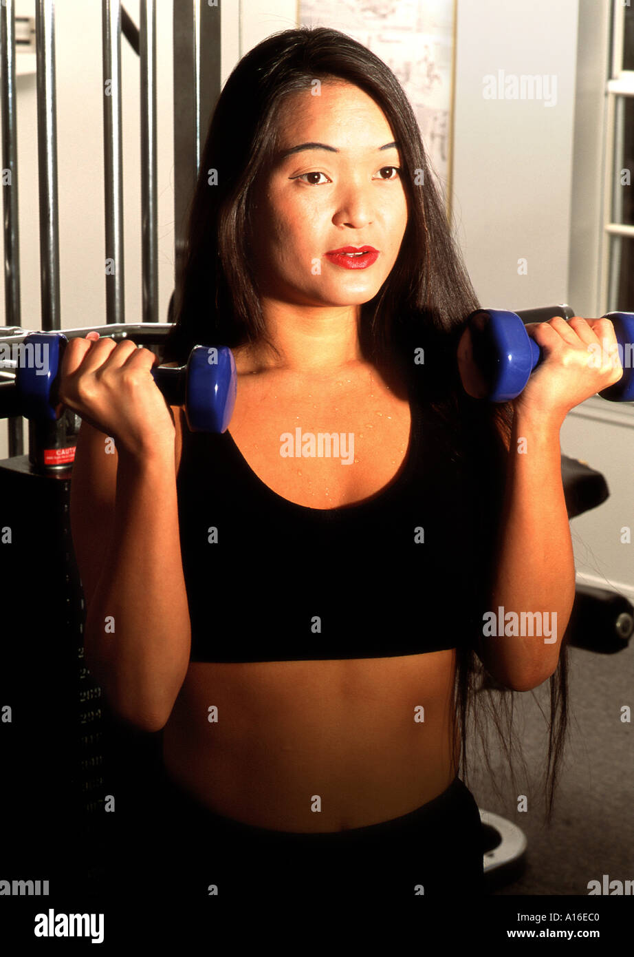 Exercise Healthy Asian woman lifting weights Stock Photo - Alamy