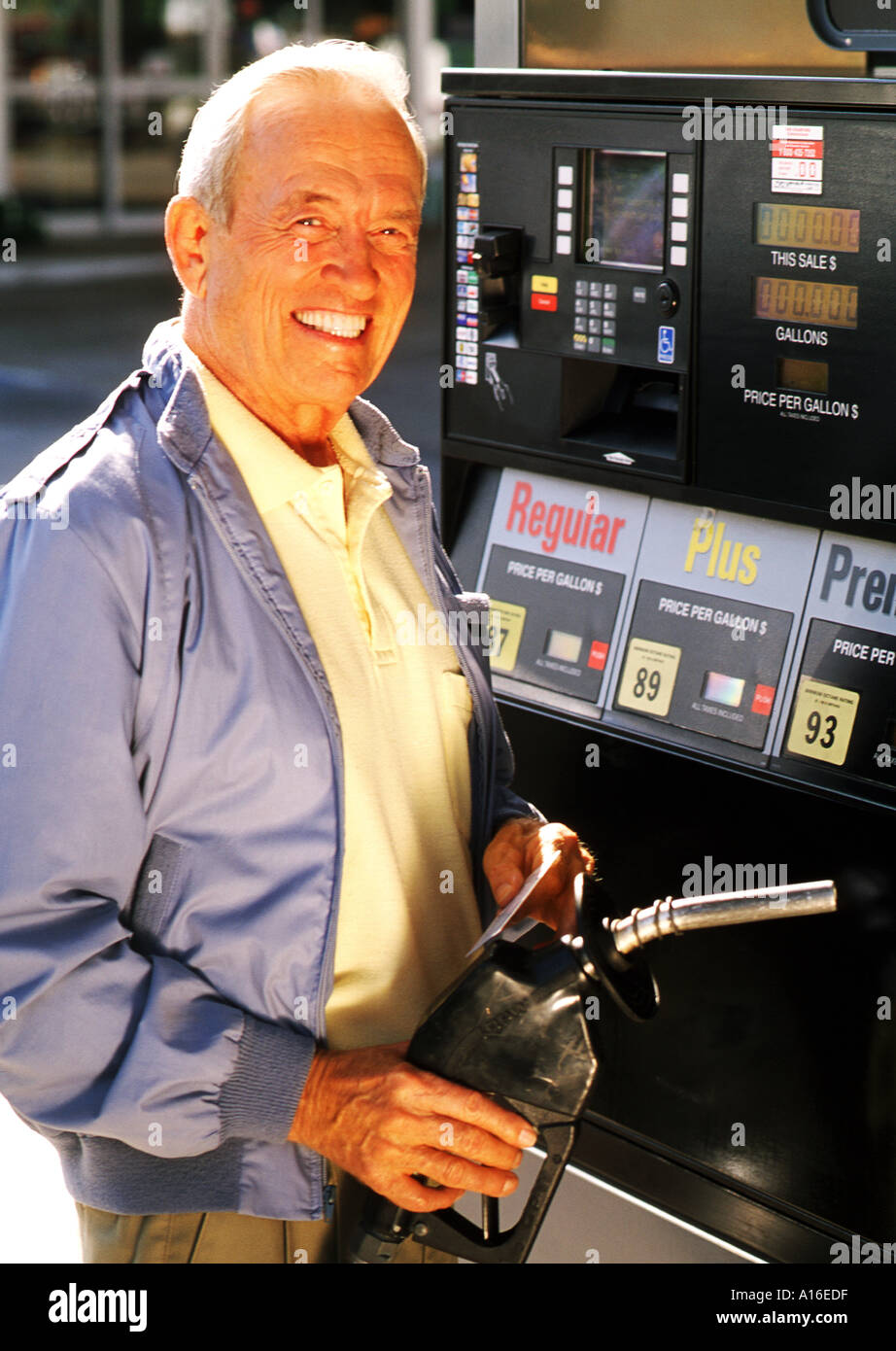 Testimonial Retired man pumping gas Stock Photo - Alamy