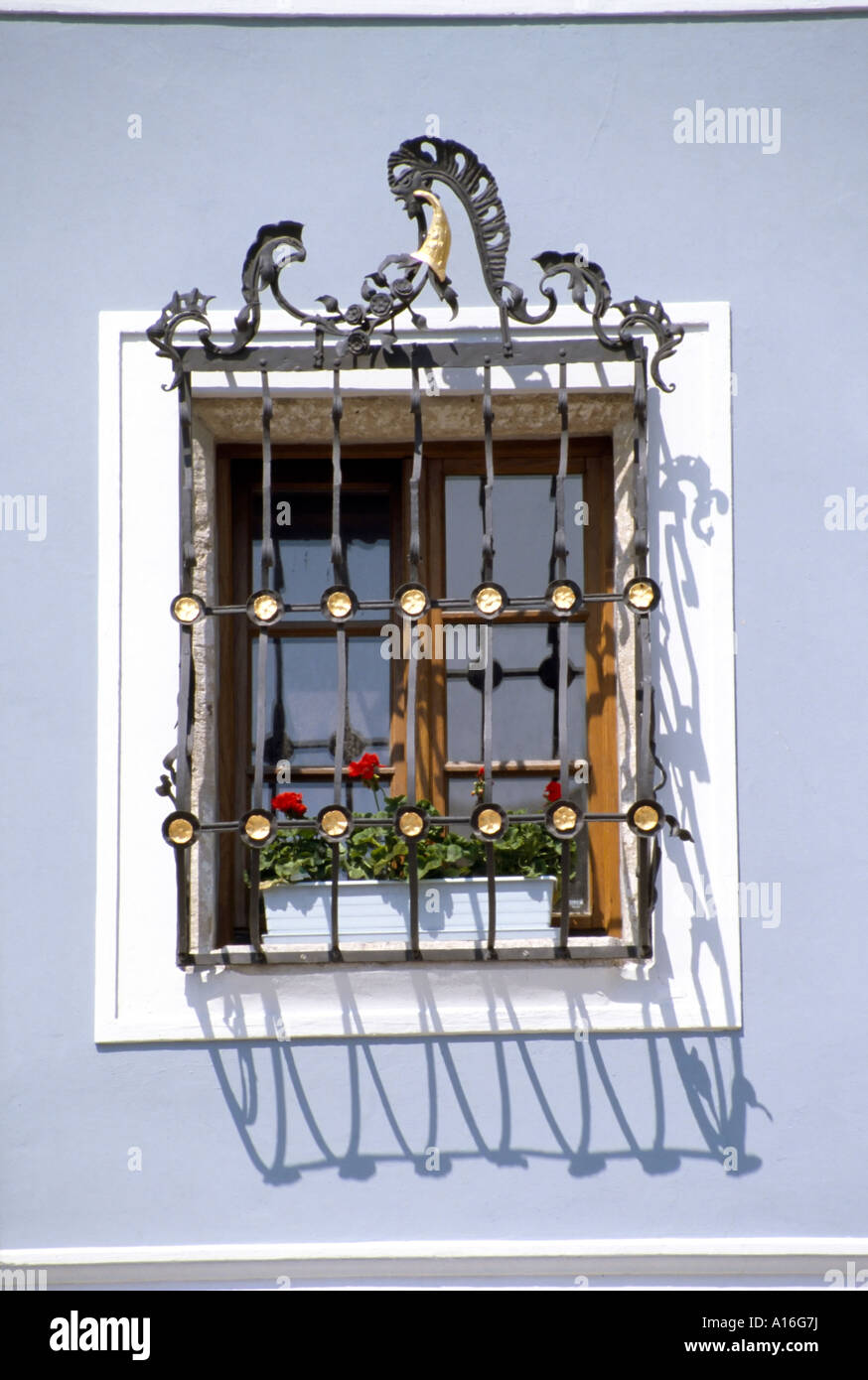 window with typical wrought iron window casing Tyrol Austria Stock ...
