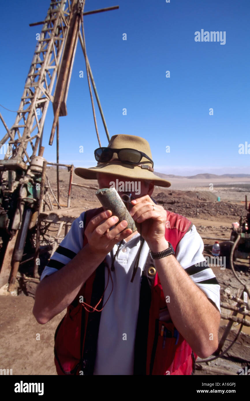 geologist checking core sample in mining camp Atacama Desert Chile ...
