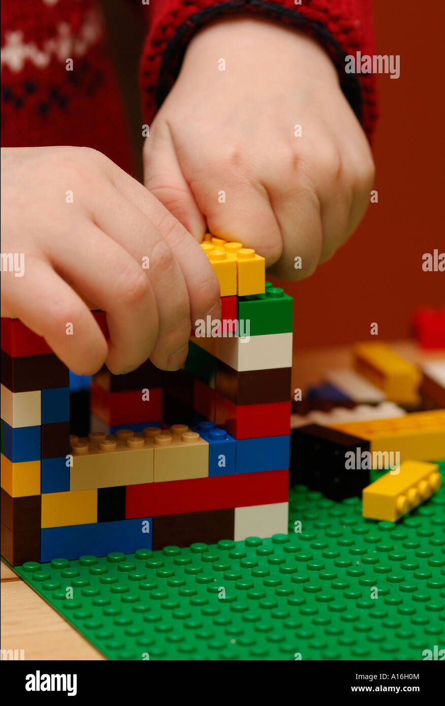 Young child playing with Lego Stock Photo - Alamy