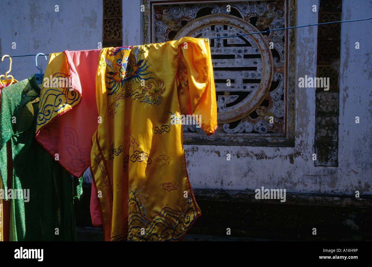 Costumes hanging on a line at a Temple in Hue Stock Photo - Alamy