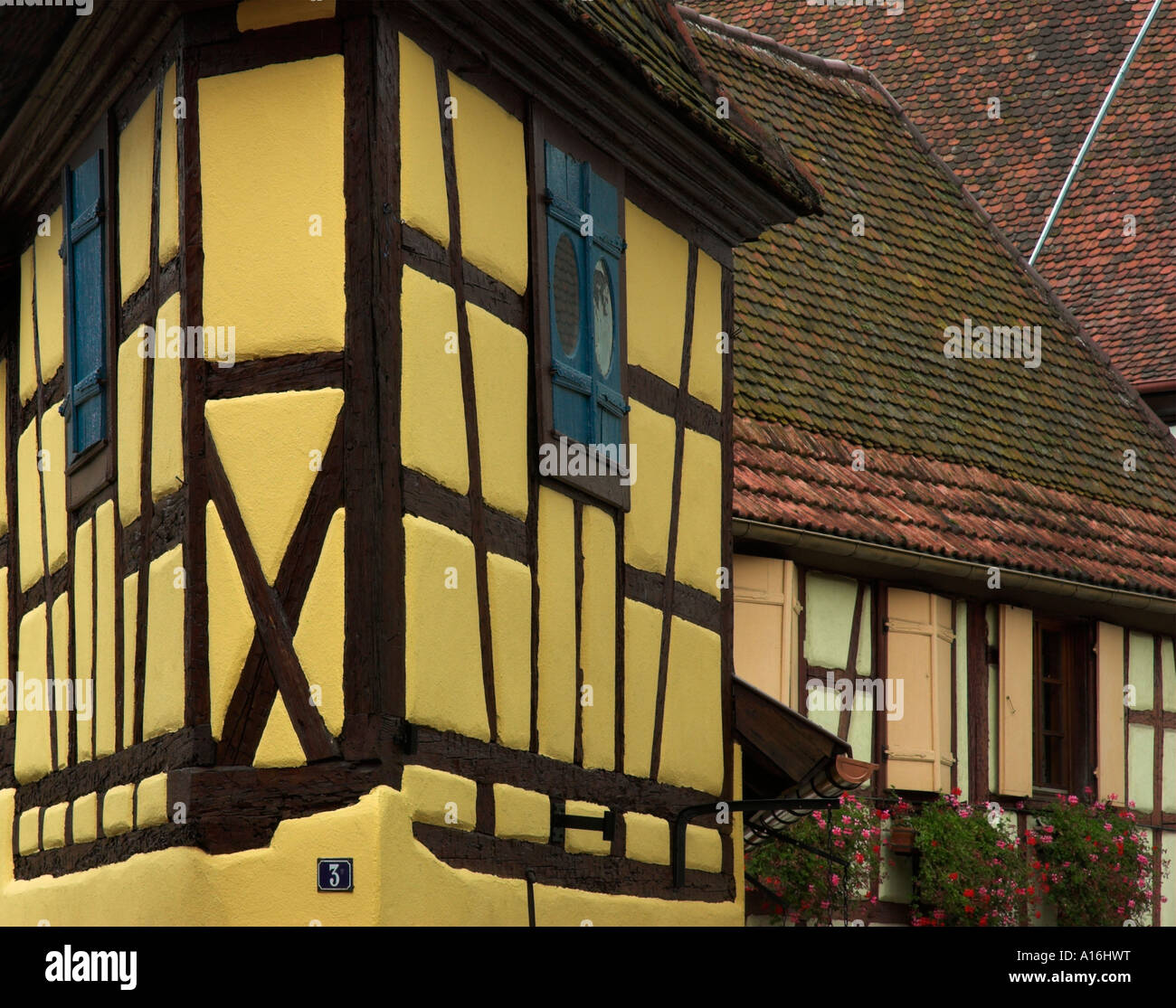 Very old yellow buildings in the lovely Alsace village of Eguisheim ...
