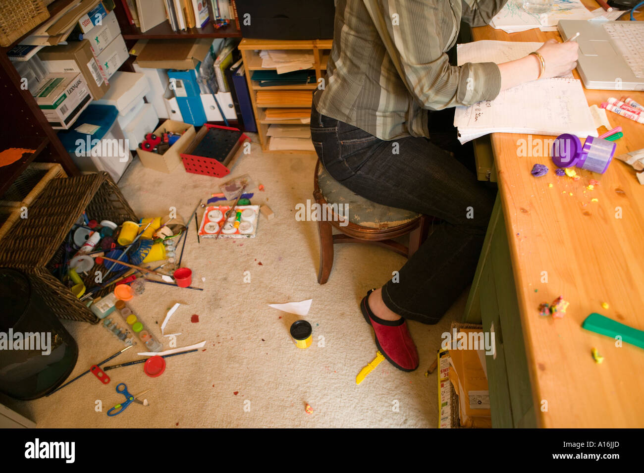 Home office and kids mess Stock Photo - Alamy