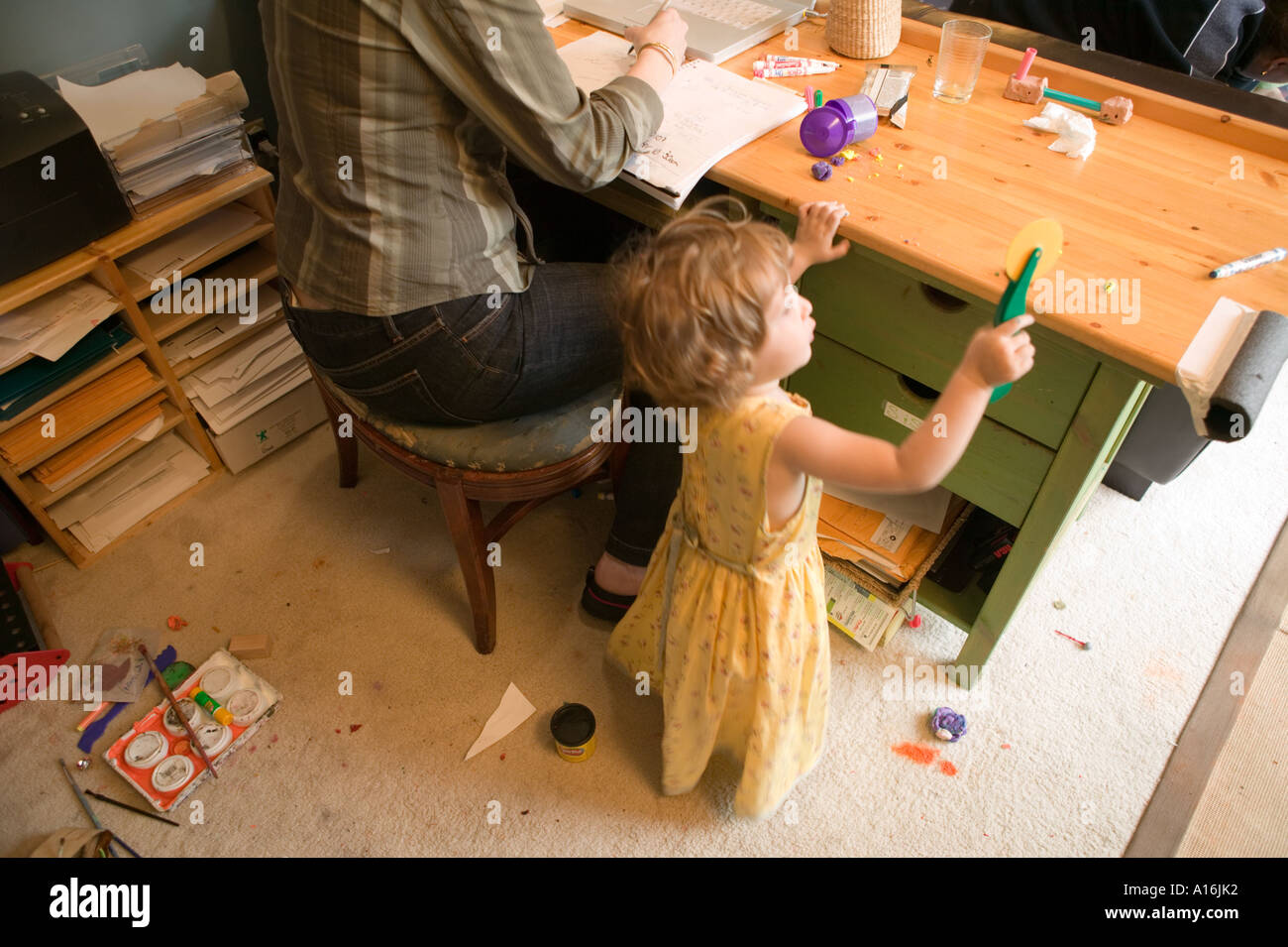 Home office and kids mess Stock Photo - Alamy