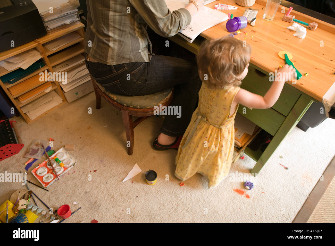Home office and kids mess Stock Photo - Alamy
