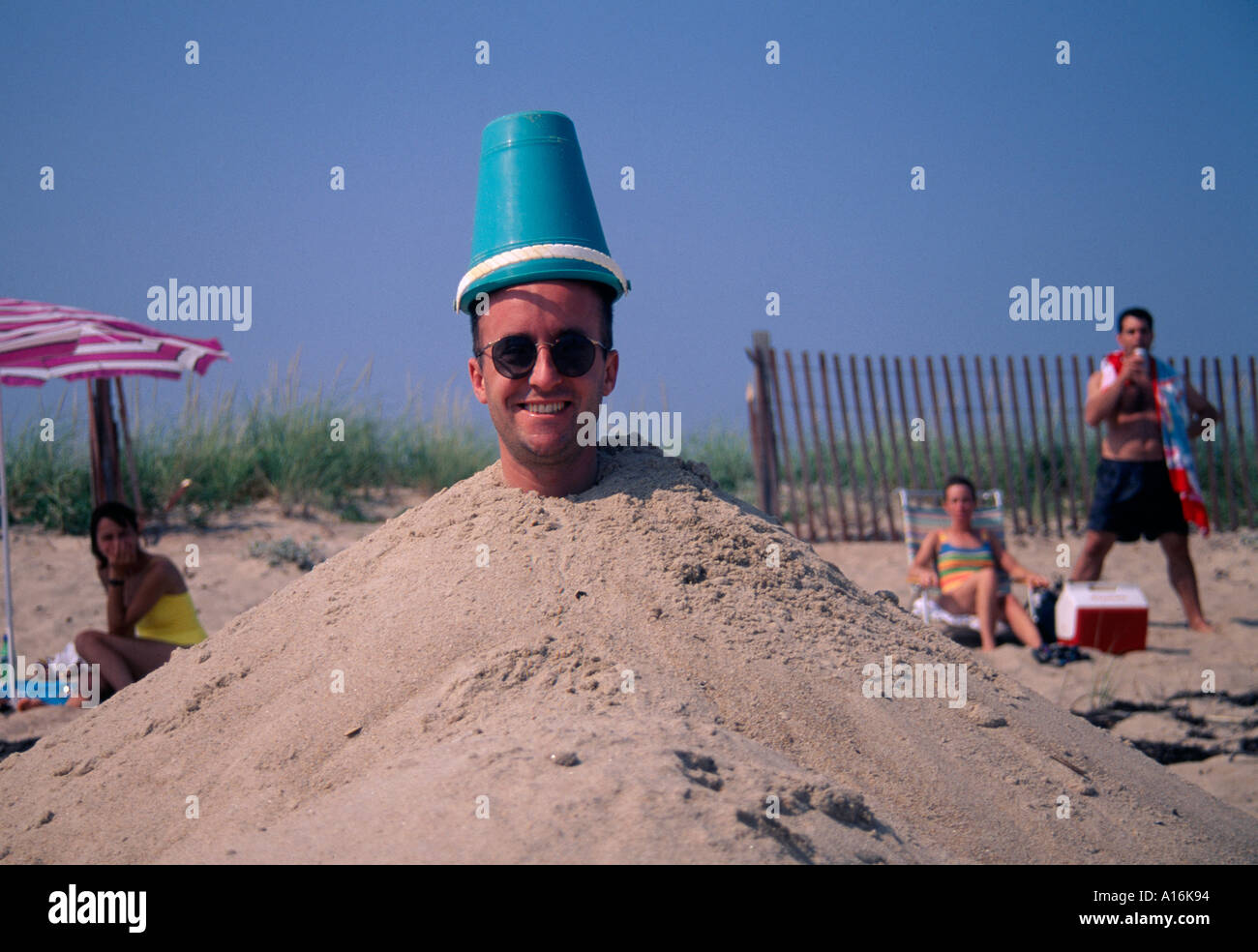 Man covered in sand hi-res stock photography and images - Alamy