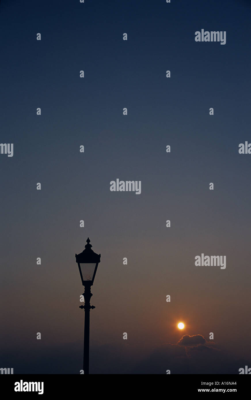 Old fashioned streetlight at sunset Stock Photo - Alamy