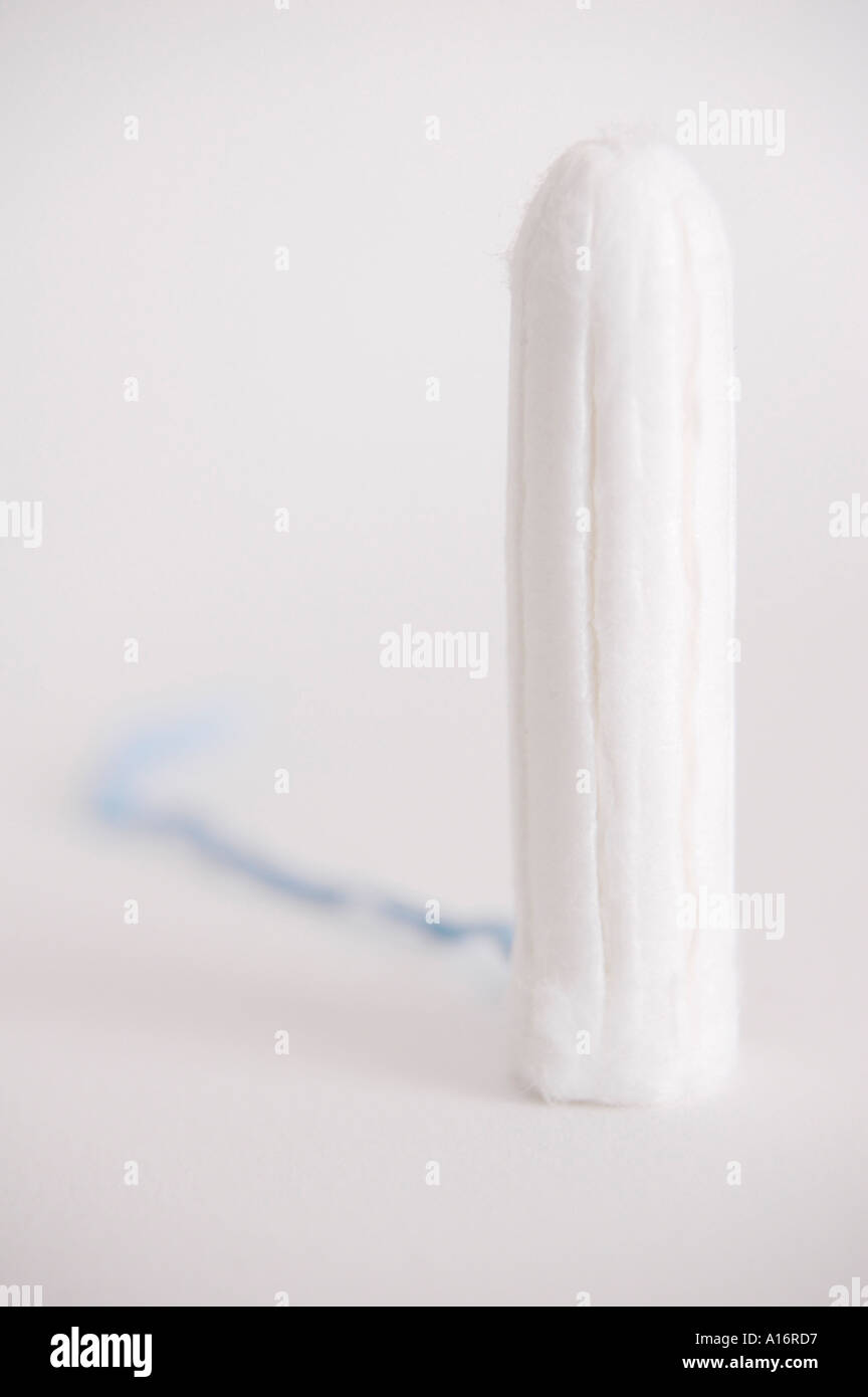 Single unwrapped tampon on a white background Stock Photo - Alamy