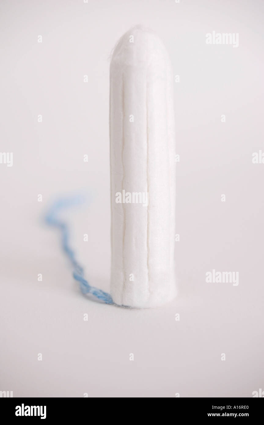 Single unwrapped tampon on a white background Stock Photo - Alamy