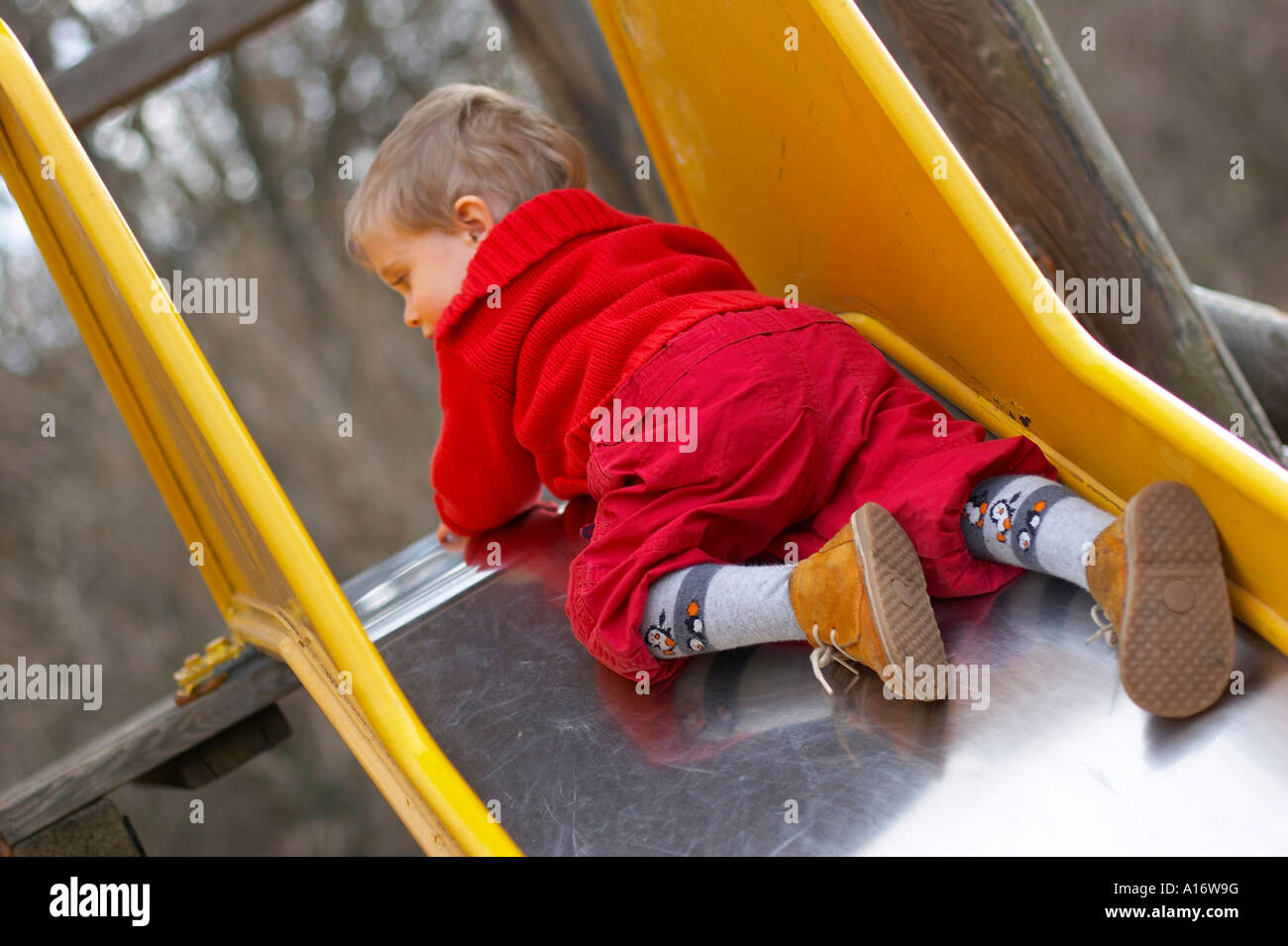 little boy on slide Stock Photo - Alamy