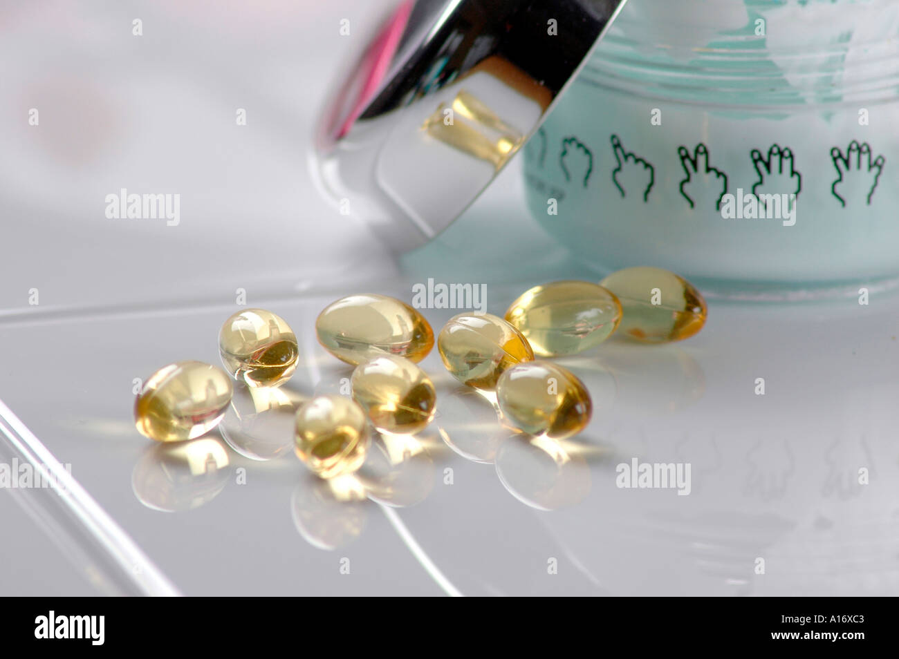 Pills and potions on a tiled surface Stock Photo - Alamy