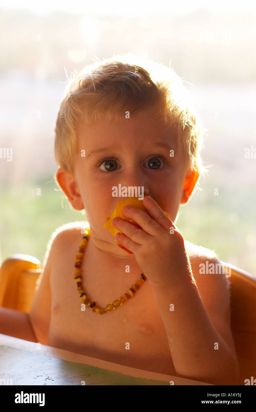 little boy sitting at table Stock Photo - Alamy
