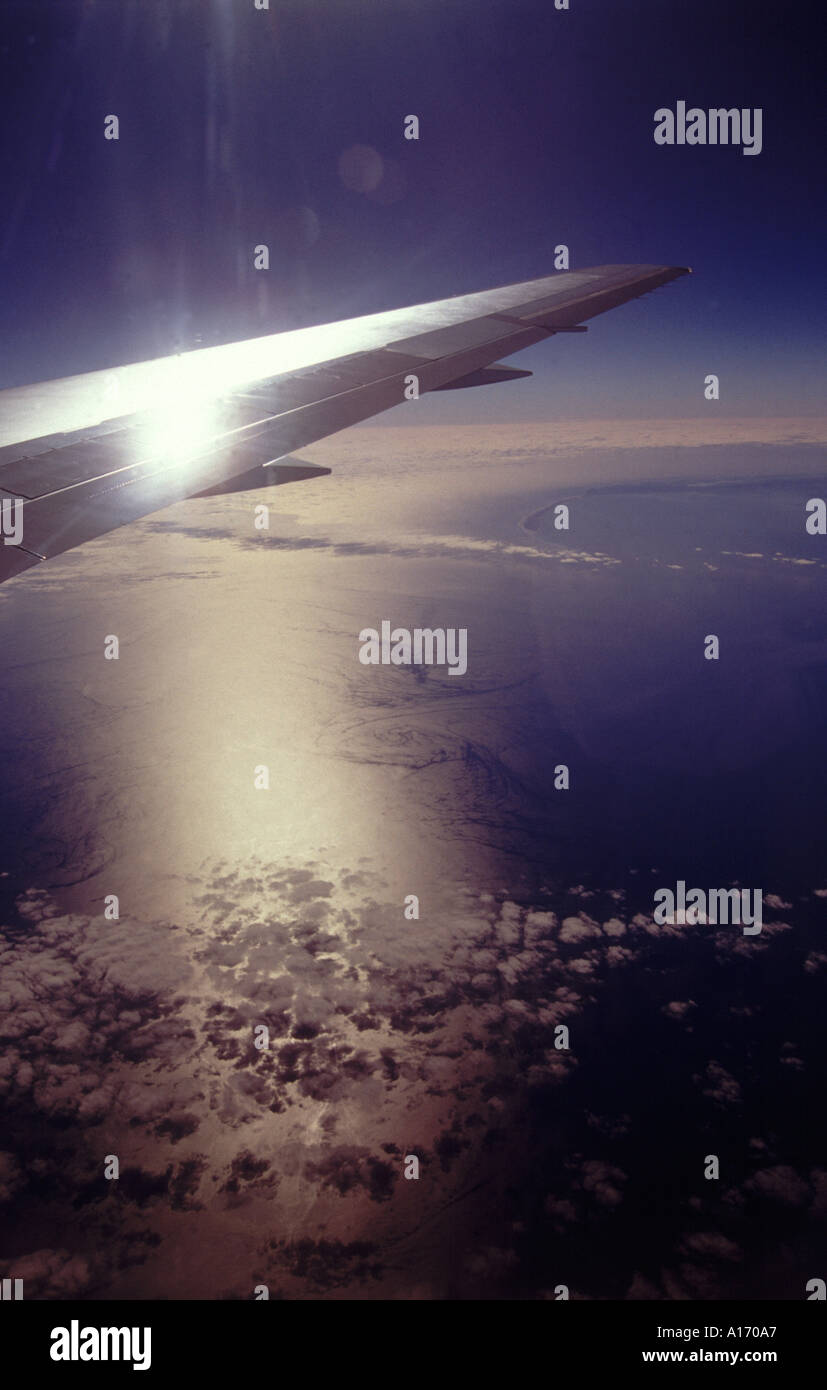 Aircraft wing and sun Stock Photo - Alamy