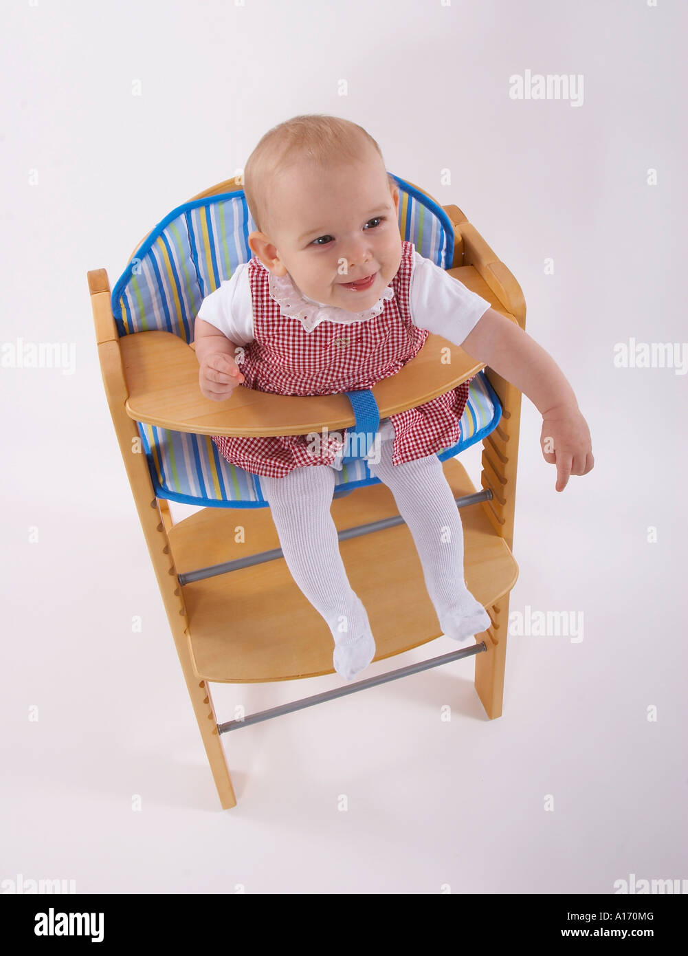 baby sitting in child seat Stock Photo - Alamy