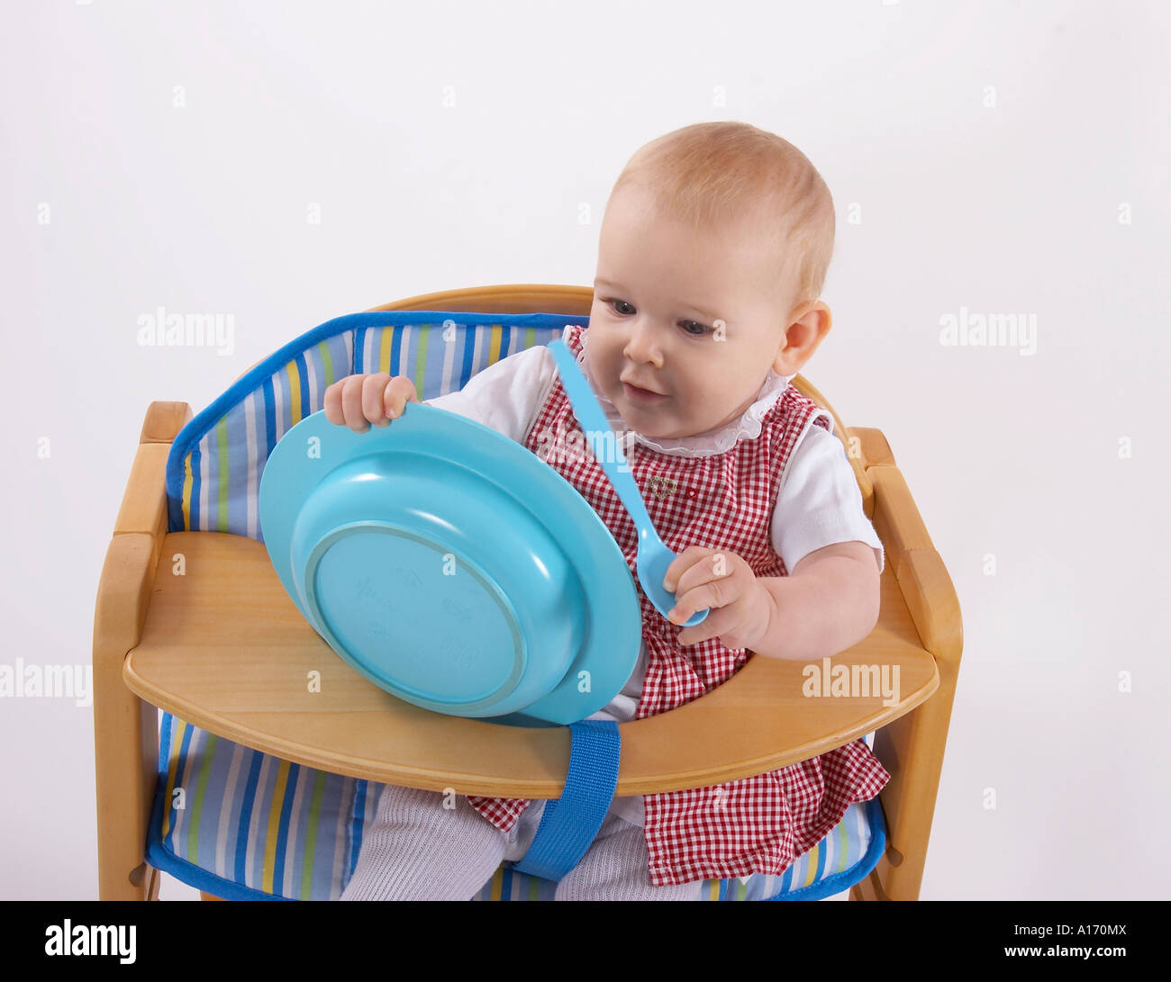 baby sitting in child seat Stock Photo - Alamy