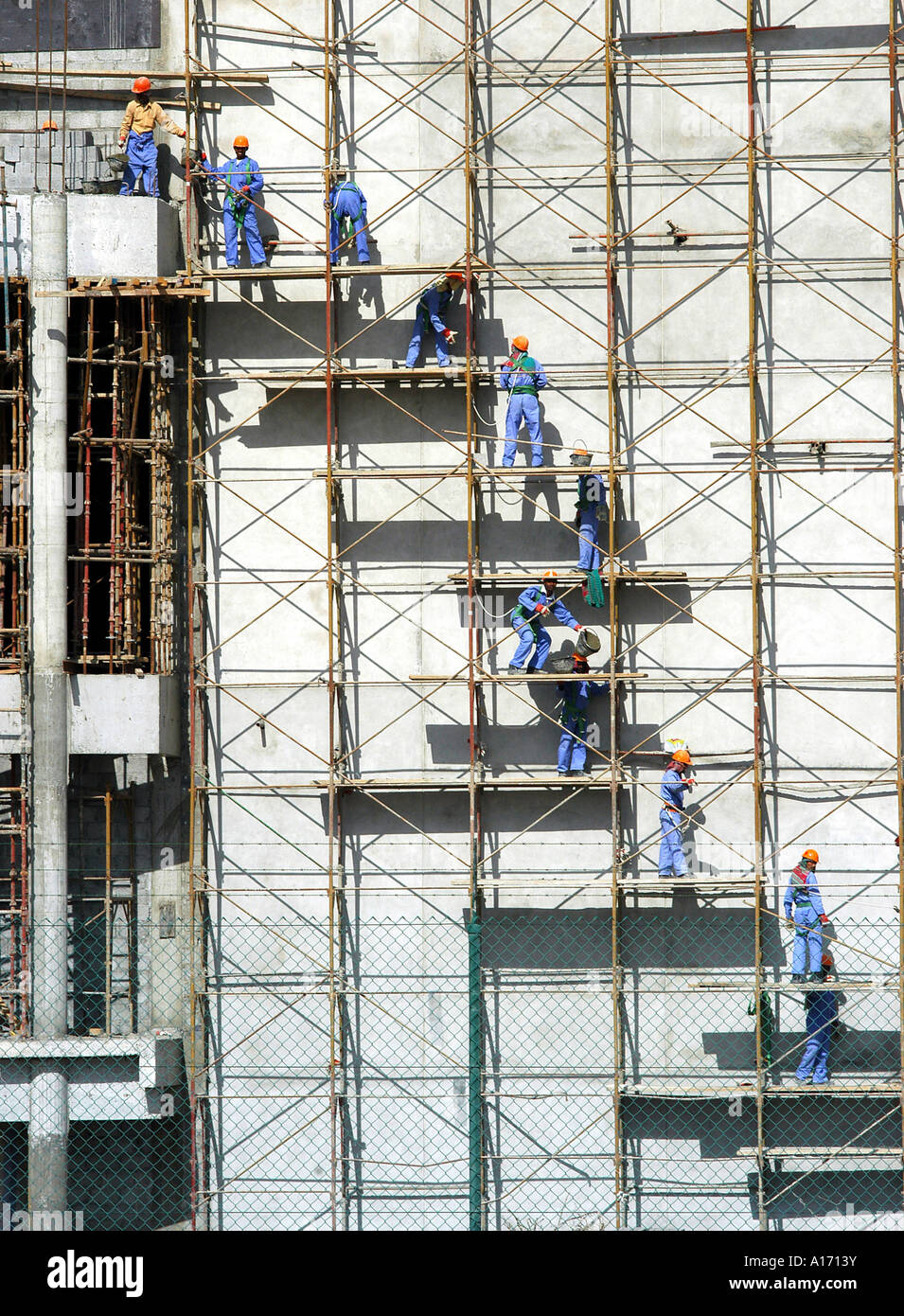Building worker on a stand Stock Photo - Alamy