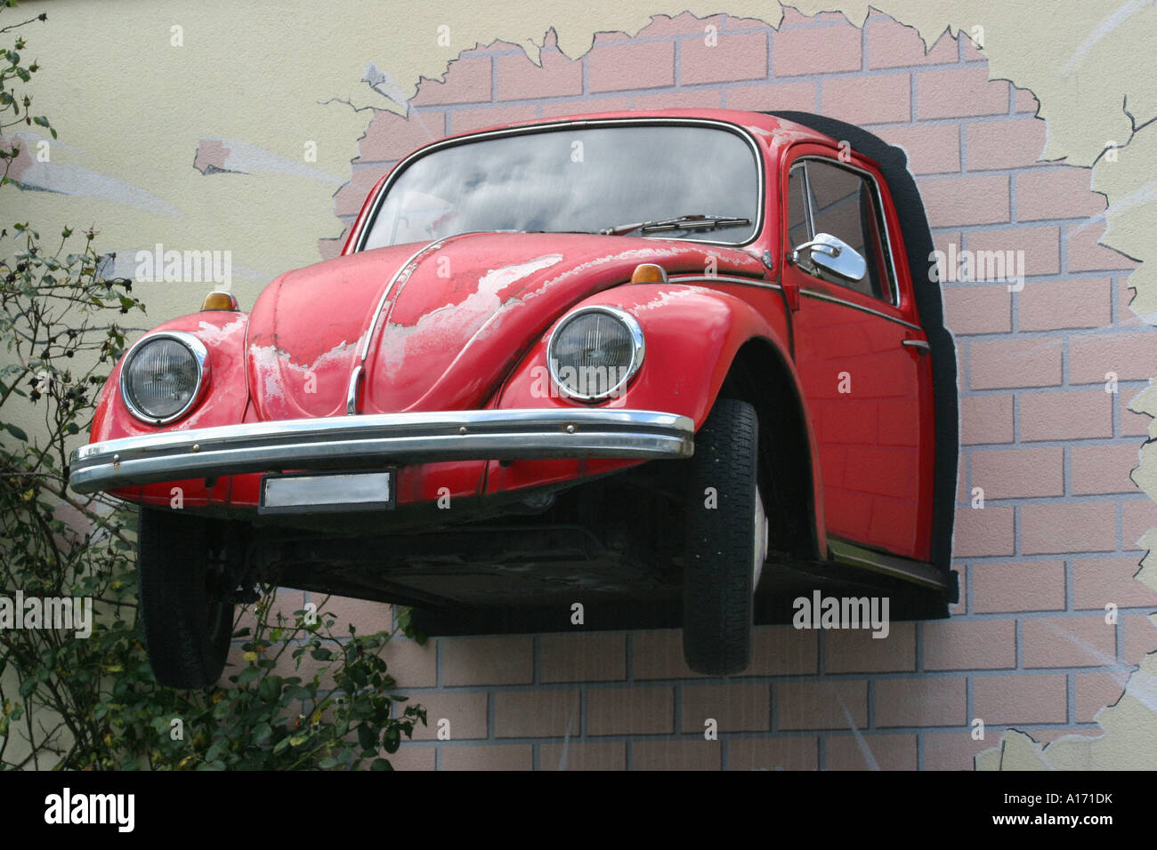 Car in the wall Stock Photo - Alamy