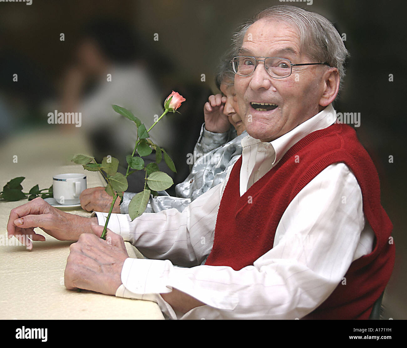 old man with a rose Stock Photo - Alamy