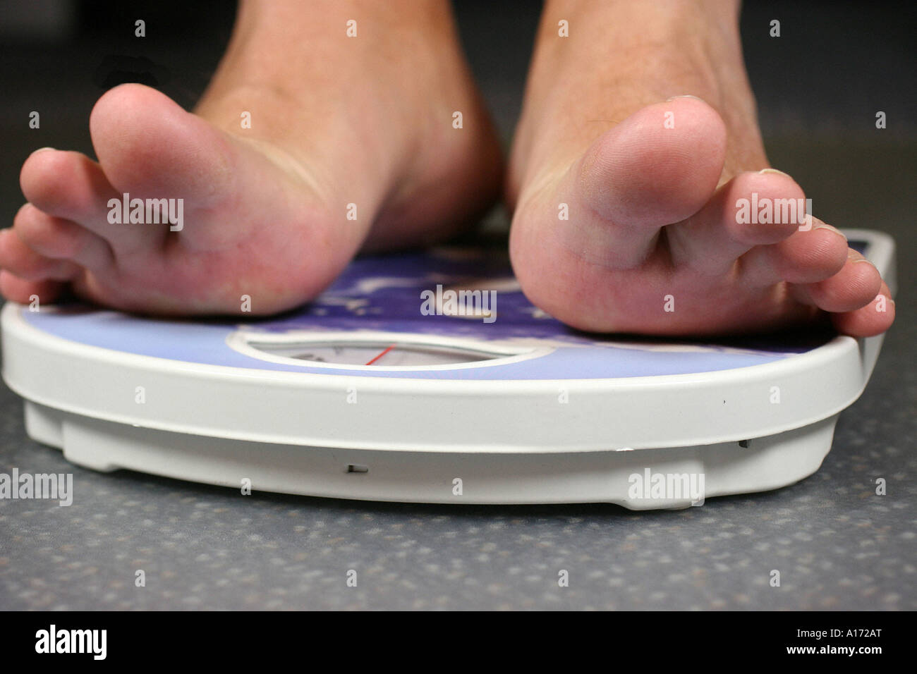 feet on a scale Stock Photo - Alamy