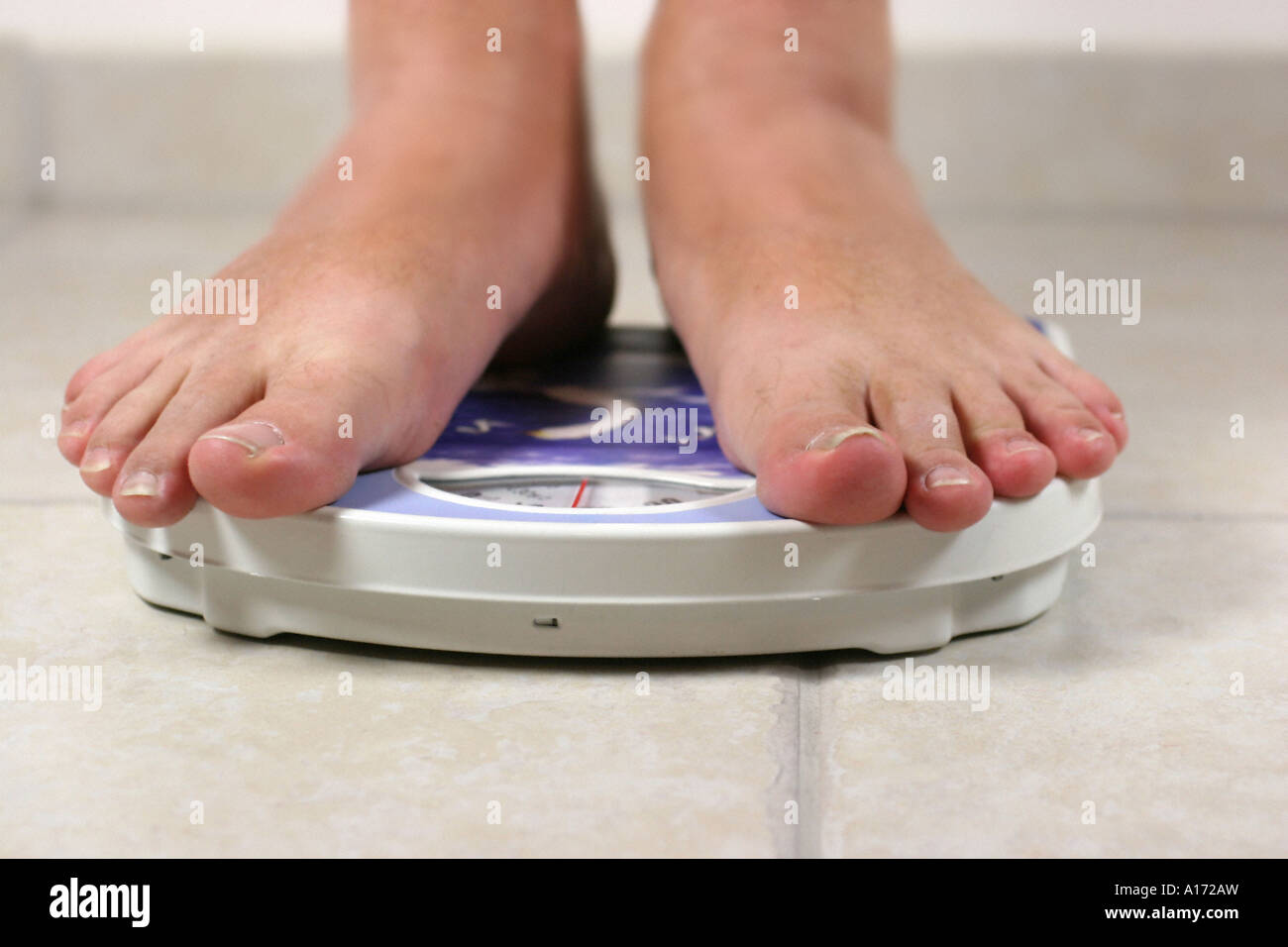 feet on a scale Stock Photo - Alamy