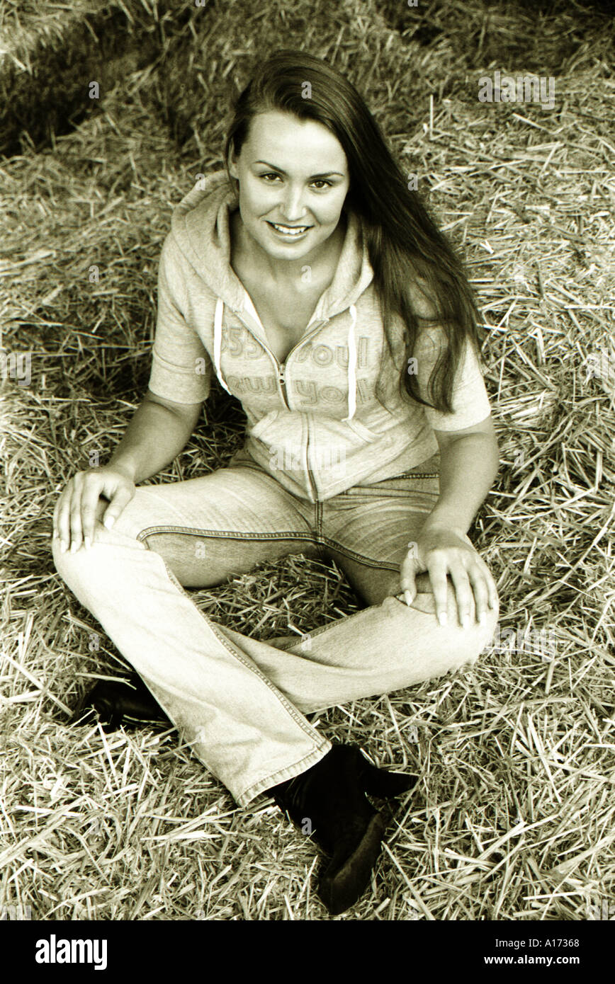 Model sat in barn Stock Photo - Alamy