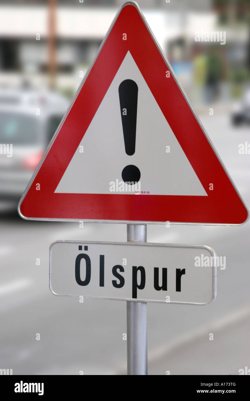 Warning oil on road Stock Photo - Alamy