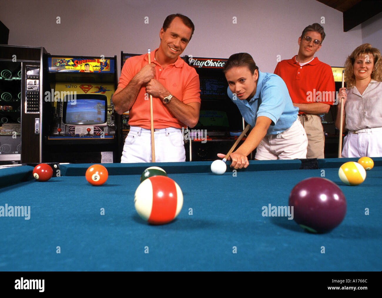 Attractive middle aged couple playing pool Stock Photo - Alamy