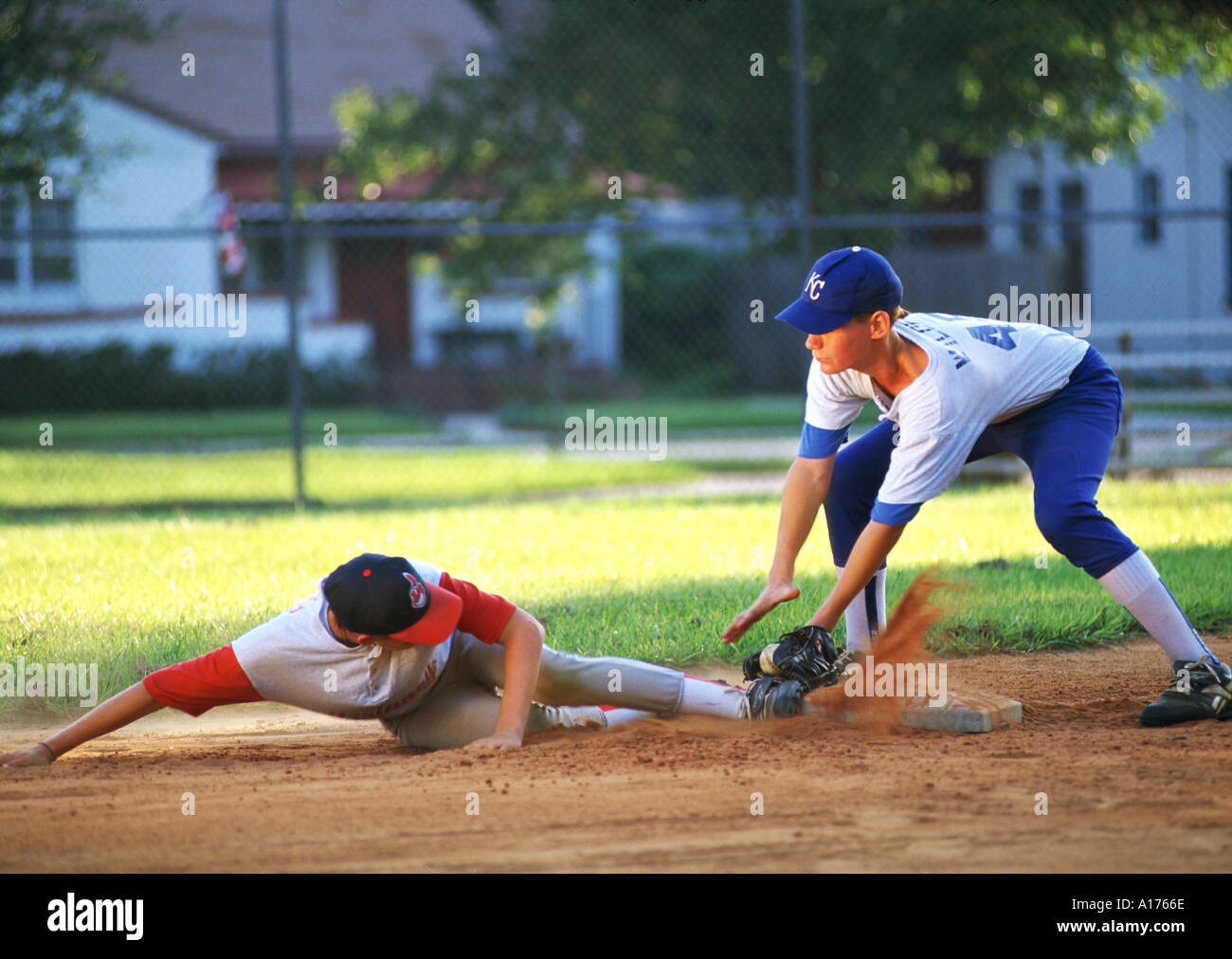 Action Baseball player sliding into base Stock Photo - Alamy