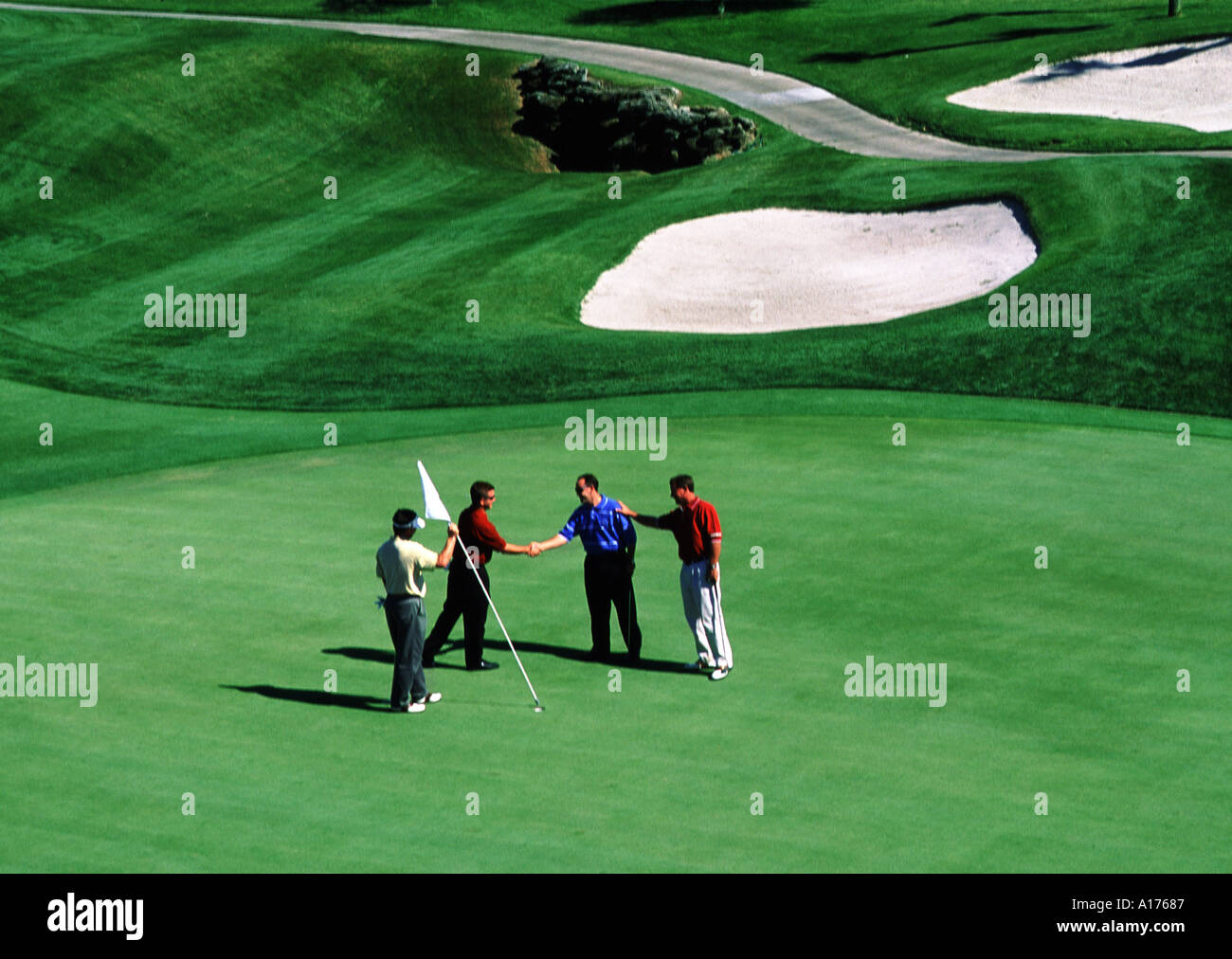 Aerial Four men golfing together shaking hands Stock Photo - Alamy