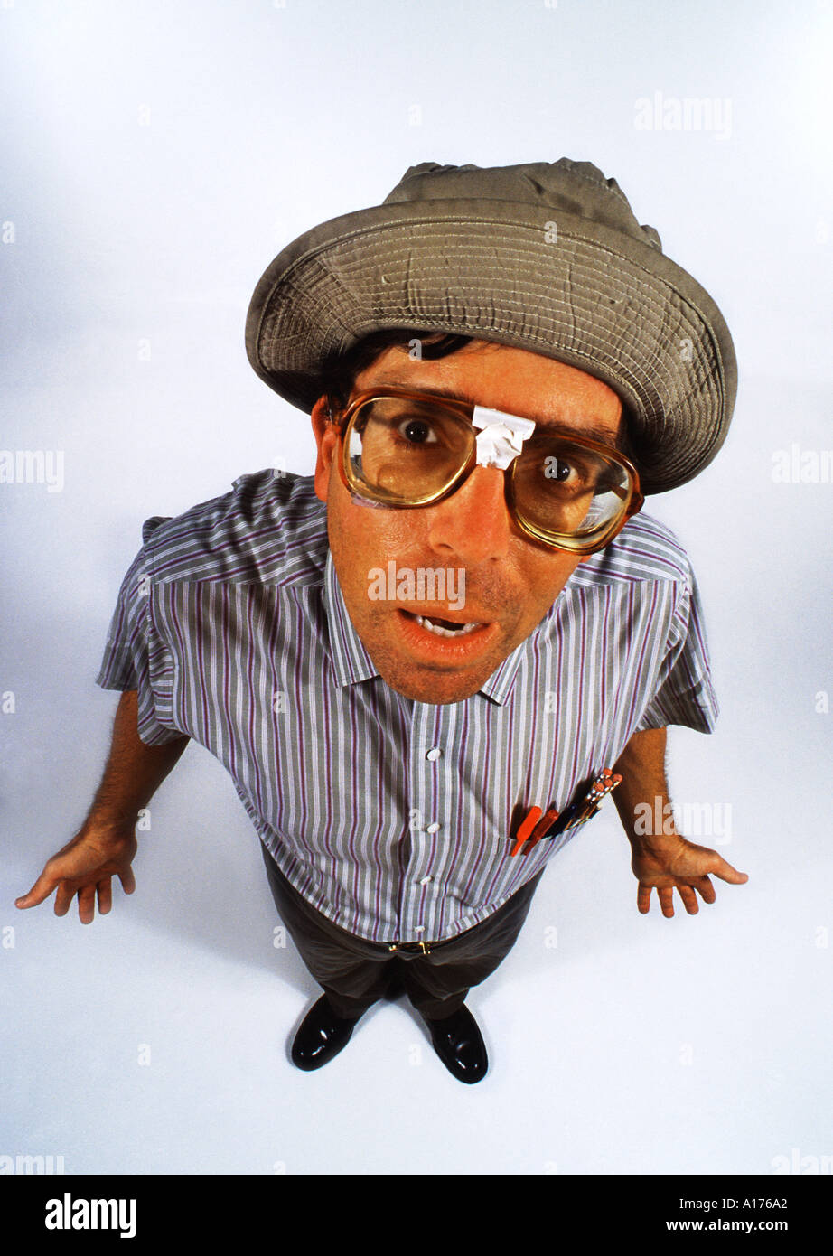 Extreme Expressions Nerdy man looking up at camera Stock Photo - Alamy