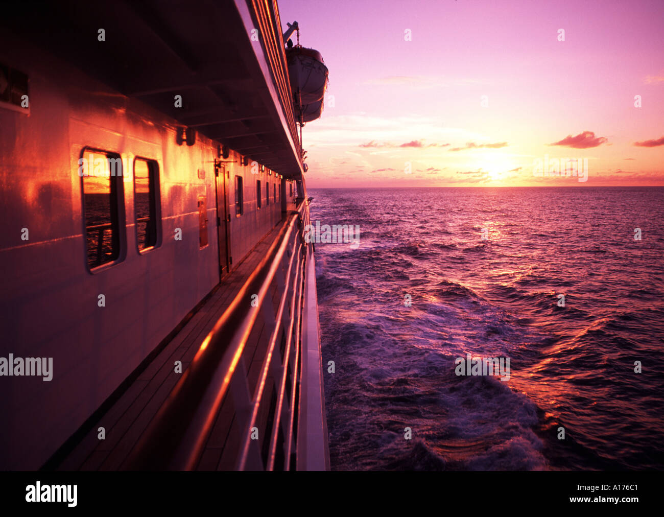 Colorful sunset on a cruise ship Stock Photo - Alamy