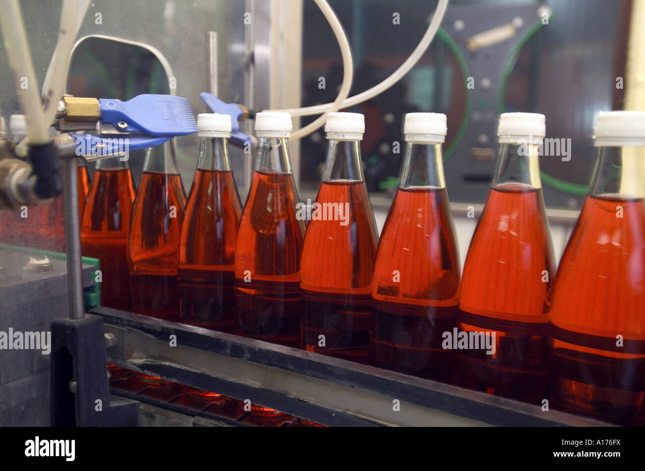 bottling plant with softdrink bottles in a brewery Stock Photo - Alamy