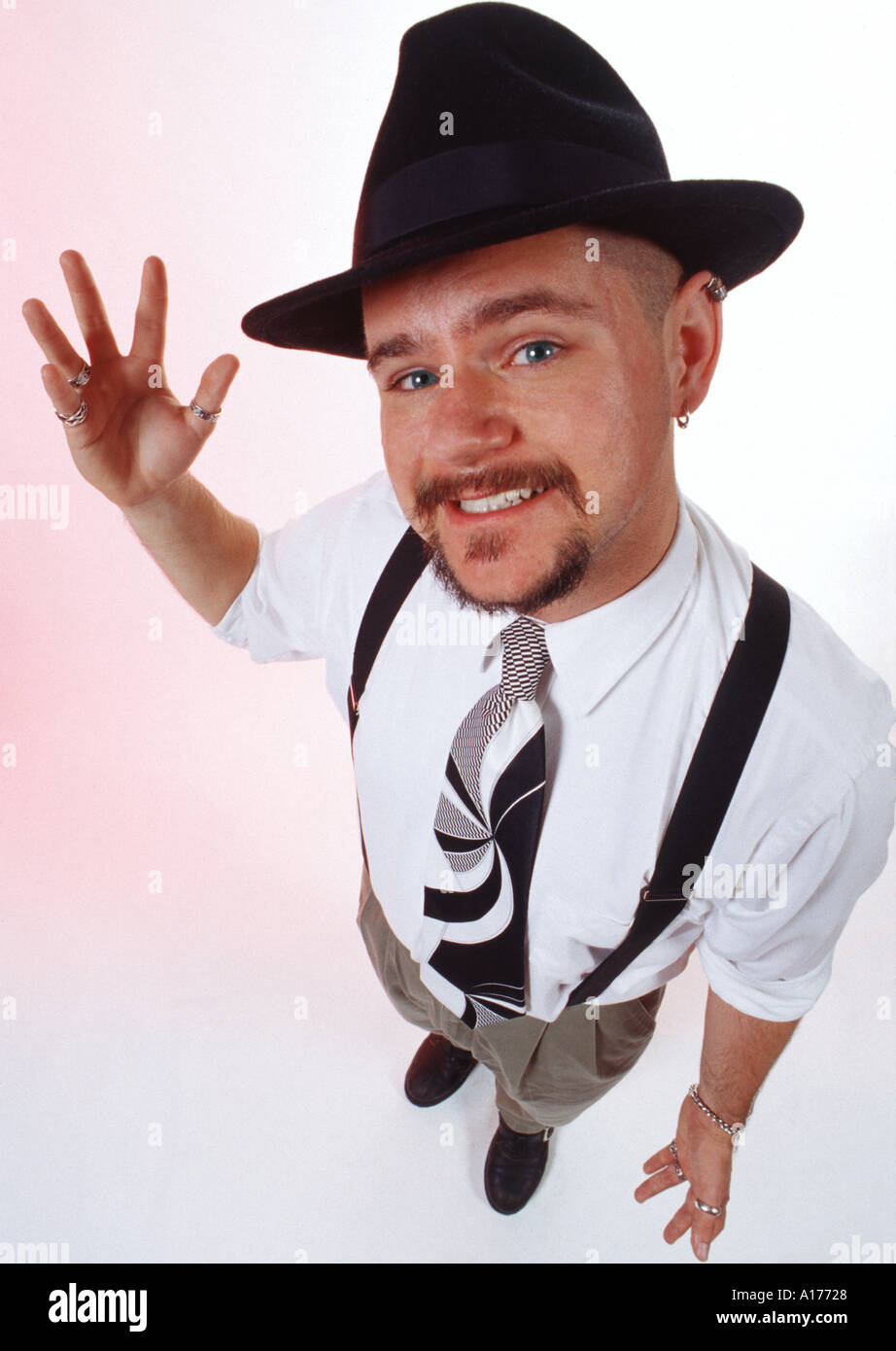 Young man wearing tie suspenders fedora Stock Photo - Alamy