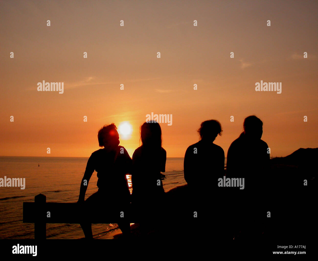 Children in front of a sunset Stock Photo - Alamy
