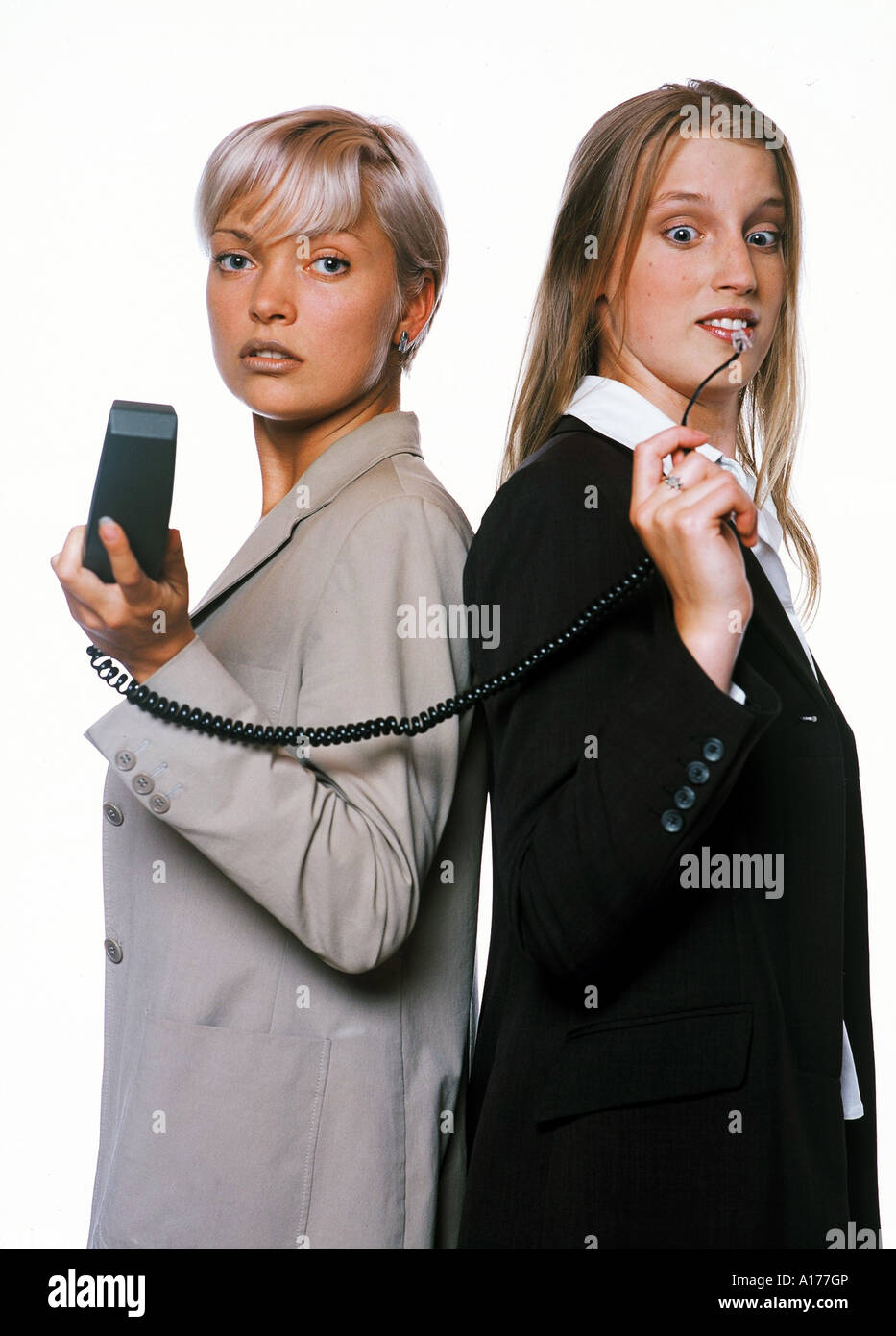 Two Business women with fixed network telephone Stock Photo - Alamy