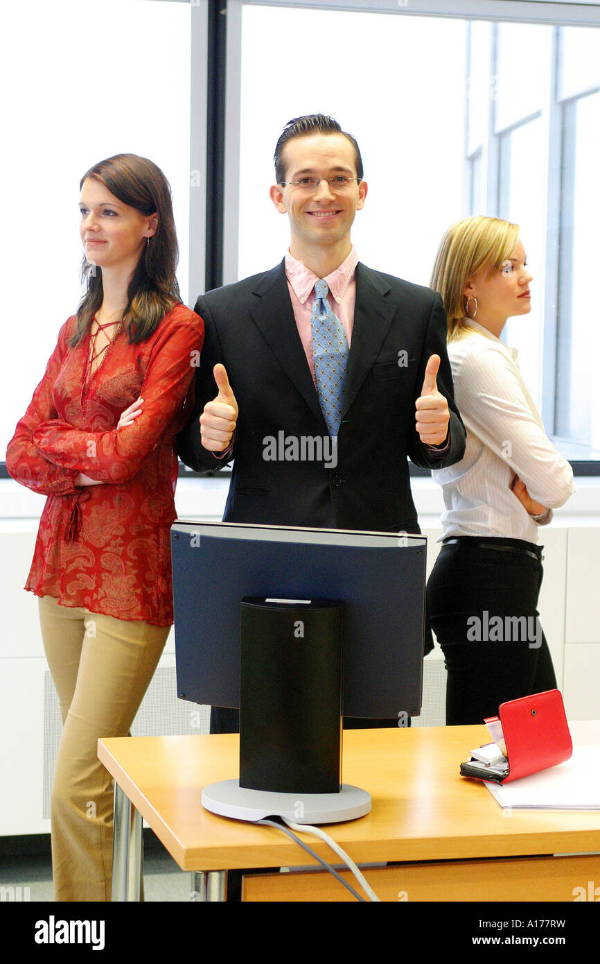 Boss and two woman employees Stock Photo - Alamy