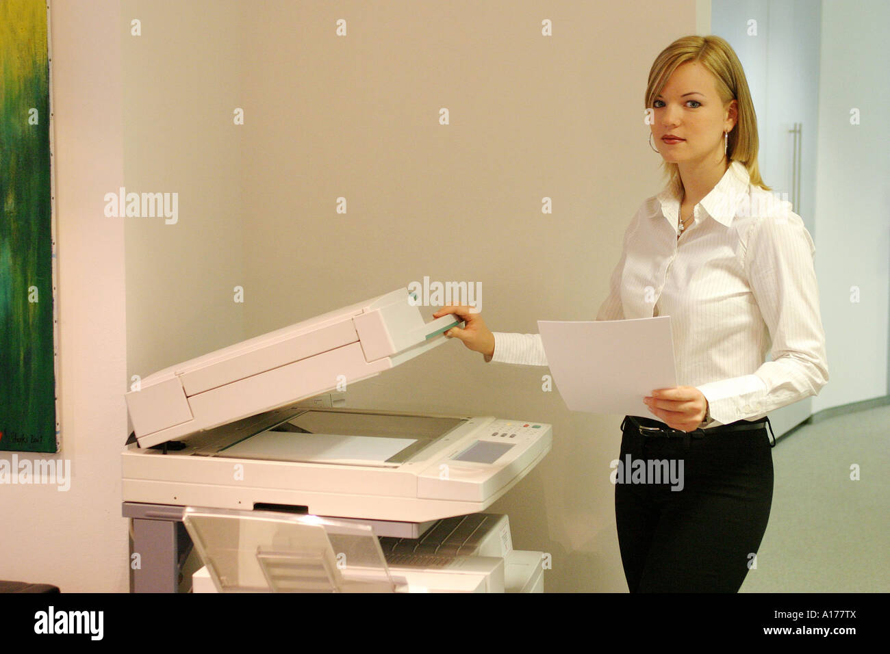 Secretary at the copier Stock Photo - Alamy